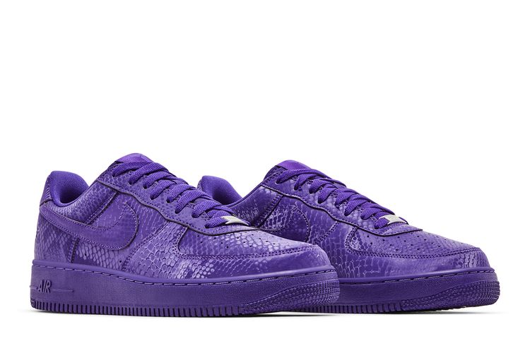 purple nike logo shoes